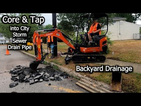 Core and tap of a concrete city storm sewer drain pipe under the street ...