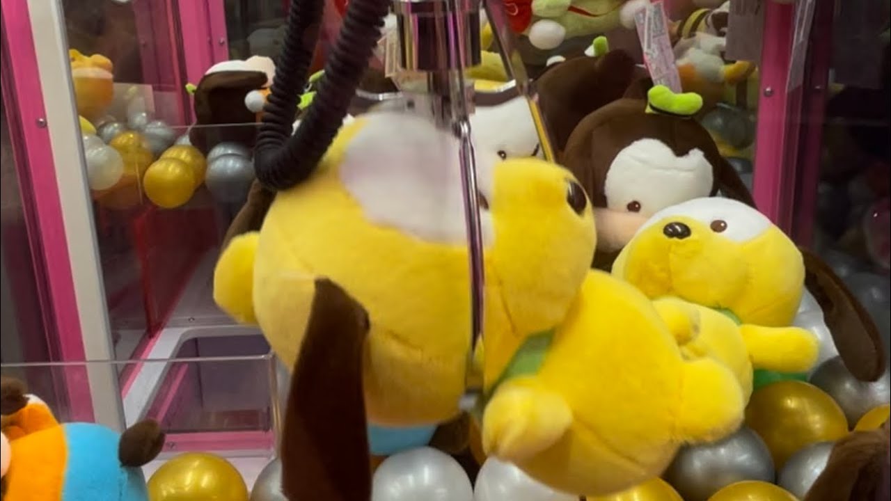 I try to grab a Claw Machine Toy at 2 different arcades in Central ...