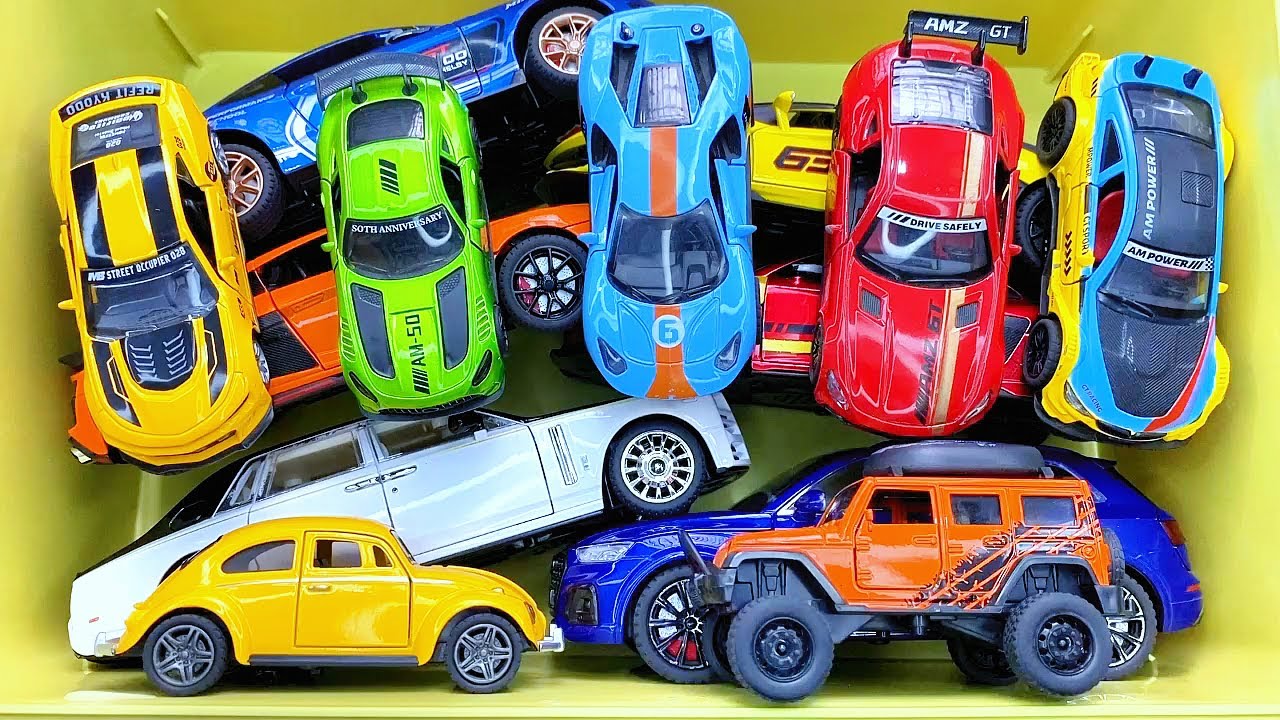 Box full of various miniature cars Peugeot, Volvo, Renault, Hyundai ...