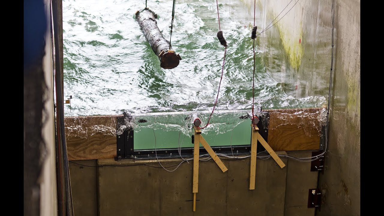 Glass flood barrier test in the DeltaFlume - YouTube
