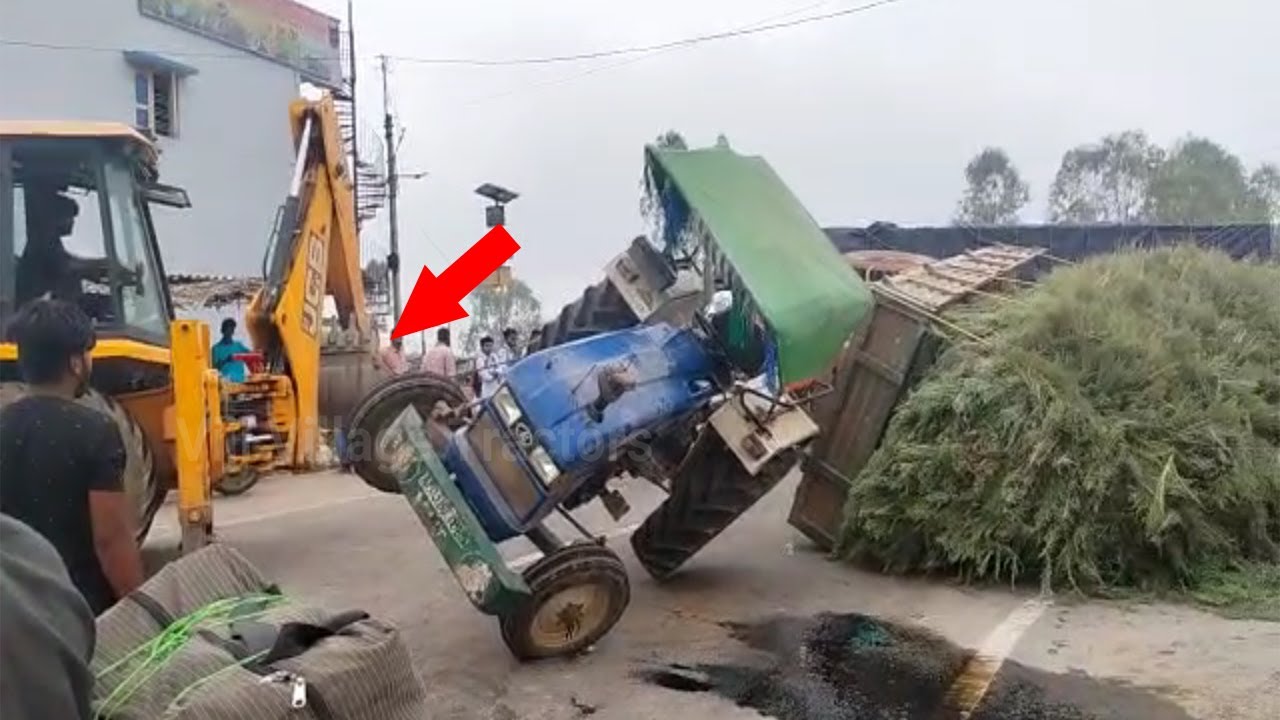 heavy load tractor roll over in road pulling in jcb - YouTube