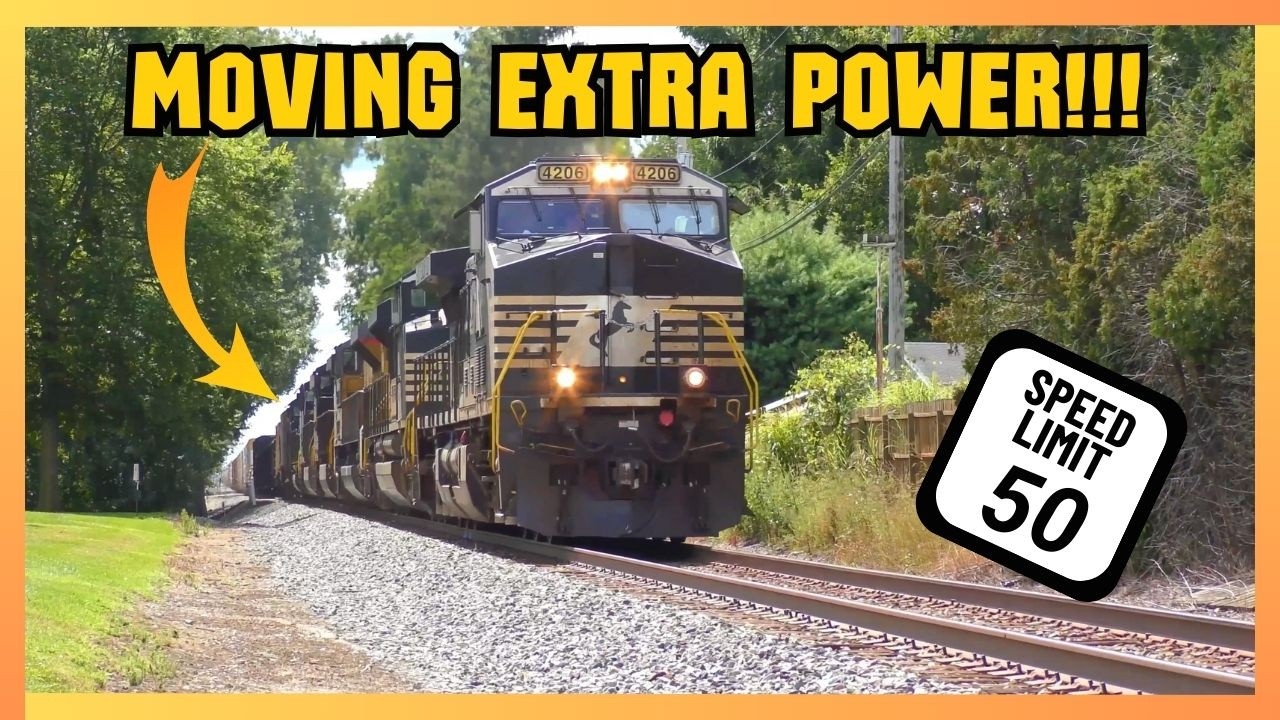 Fast moving train with extra power rolls through town at 50 mph ...