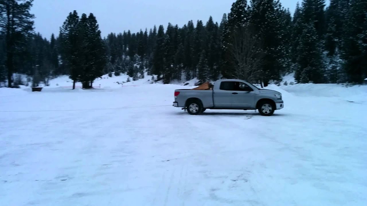 Sledding behind the truck - YouTube