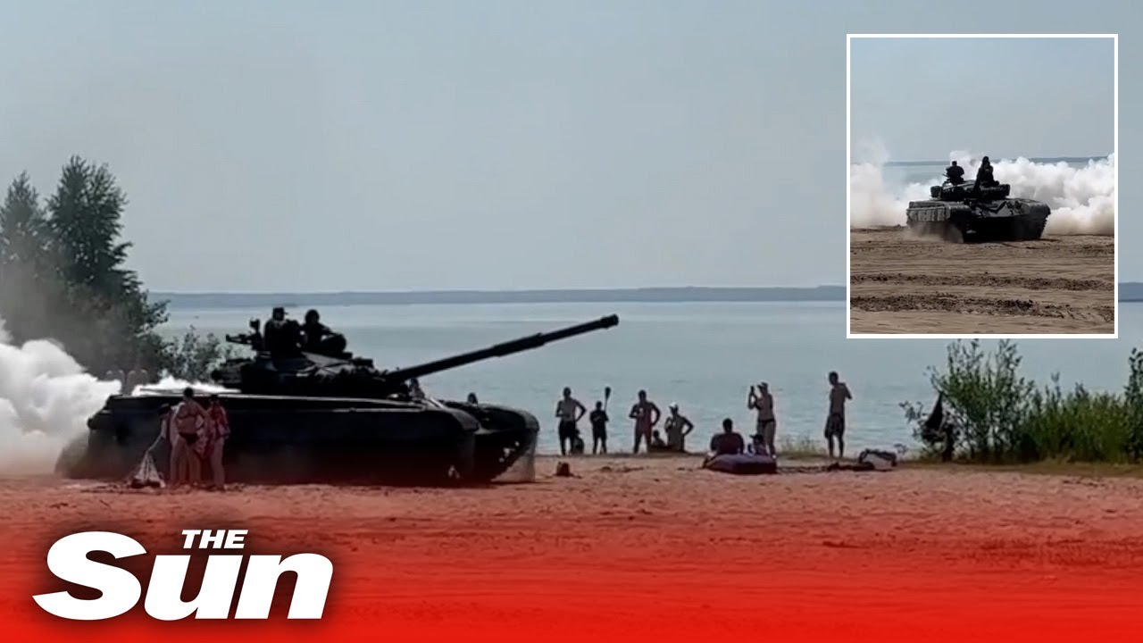 Terrifying moment Russian tank storms across tourist-packed beach ...