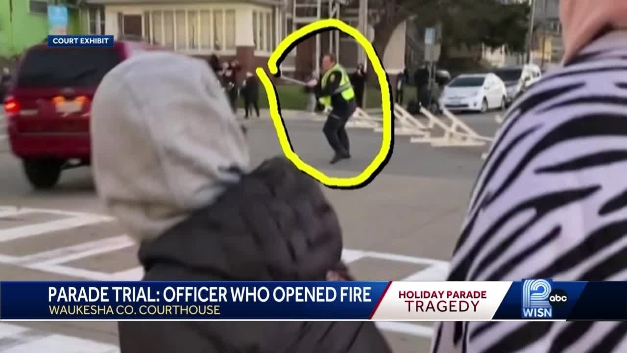 Officer who opened fire on parade suspect takes witness stand - YouTube