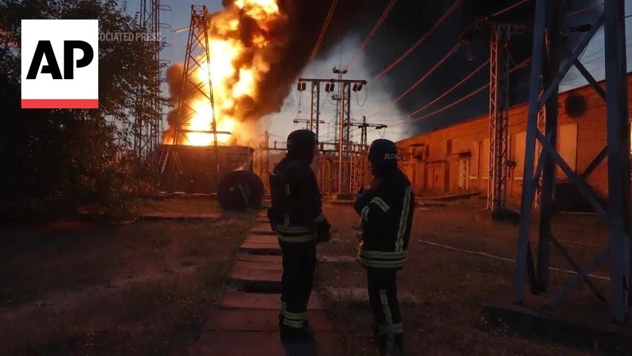 Ukrainian firefighters extinguish flames at electrical substation hit ...