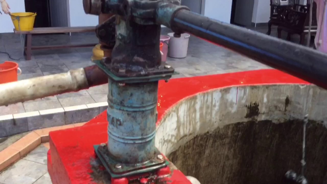 Fetching Water From A Well With Pump At Tua Pek Kong Temple - YouTube