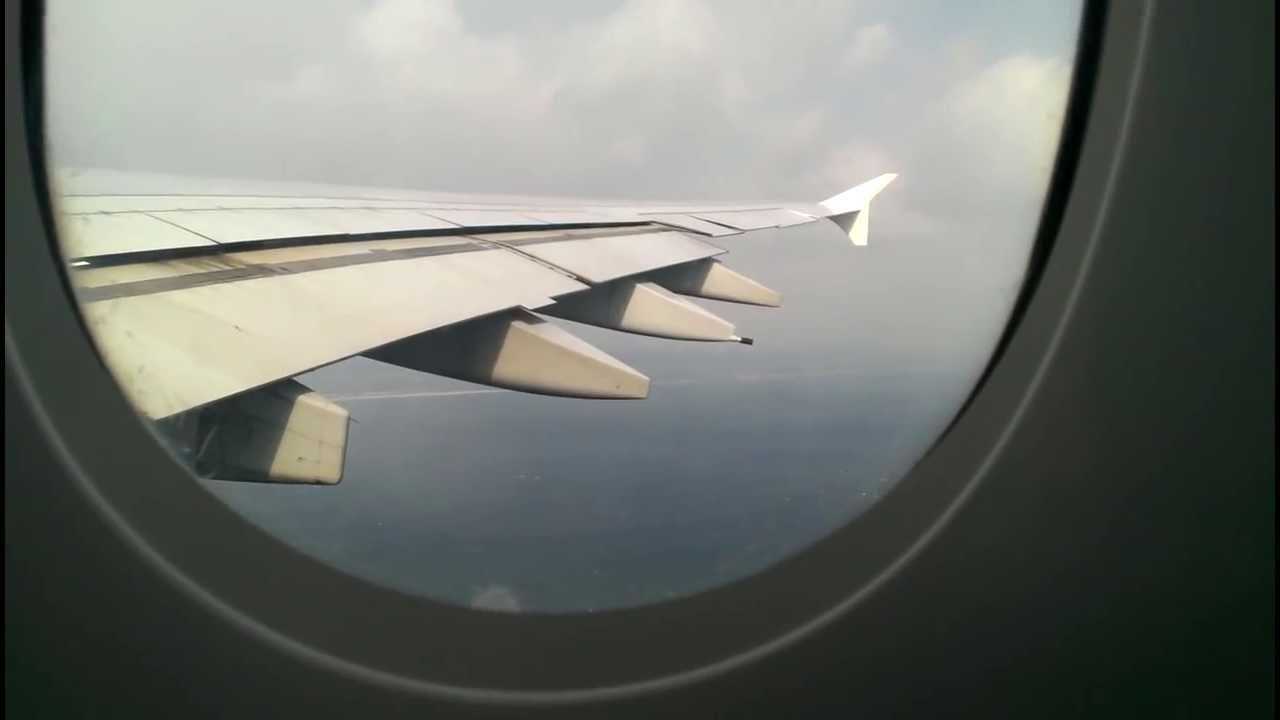 EMIRATES AIRLINES EK 201 A380 DESCENDING THROUGH THICK CLOUD AND ...