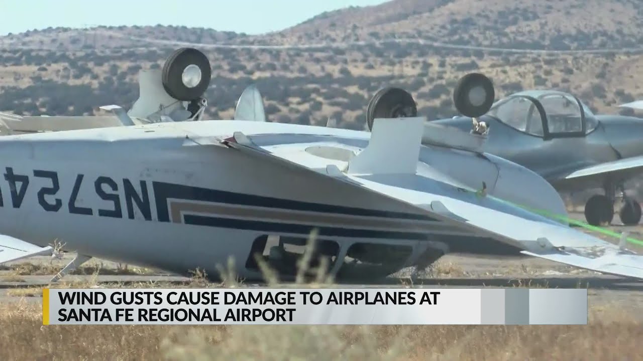 Strong wind gusts damage airplanes at Santa Fe airport - YouTube