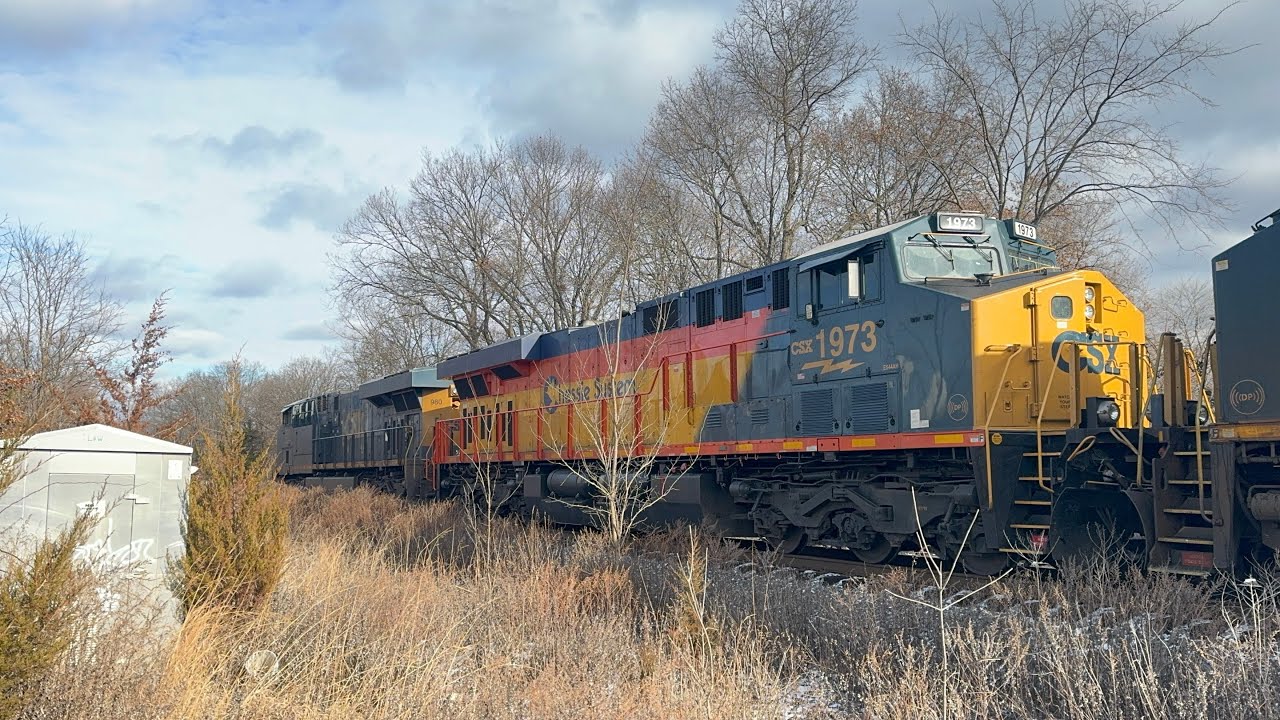 CSX 980 leads CSX I157 through Manville NJ with CSX 1973 Chessie System ...