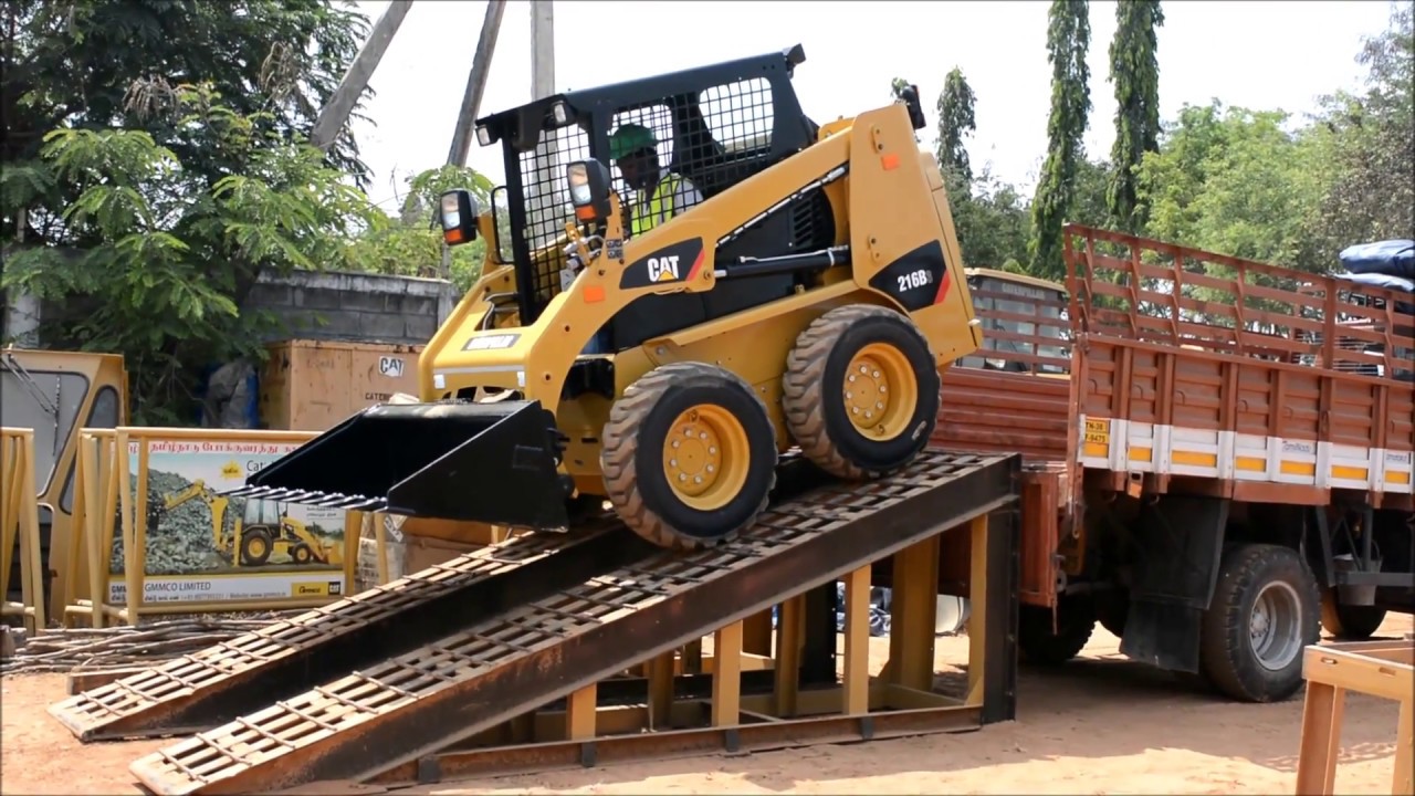 CAT 216B3 Machine Loading & Unloading - YouTube