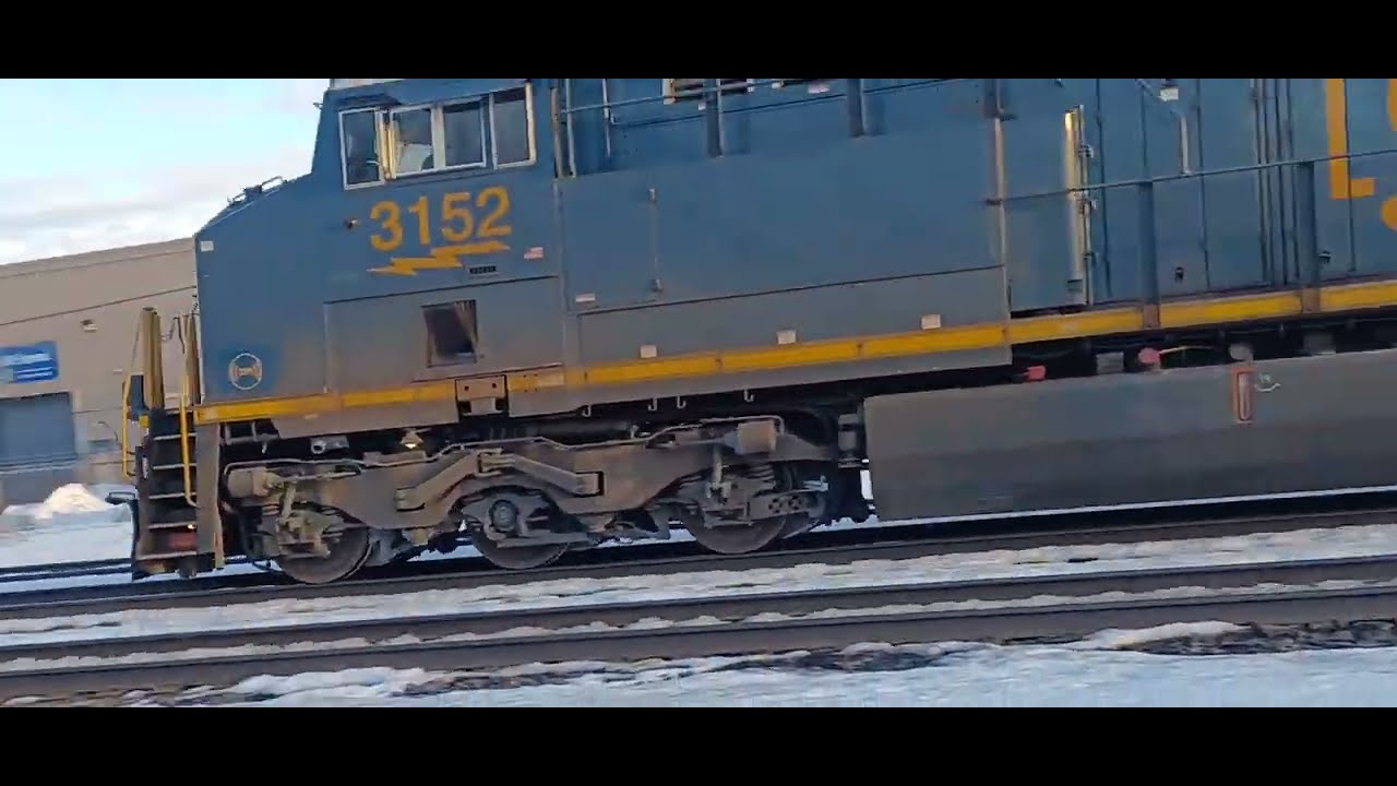 CSX ES44AH leads a long 2 half mile long Train with horn salute! with DP sticker! CSX ES44AH DPU ...