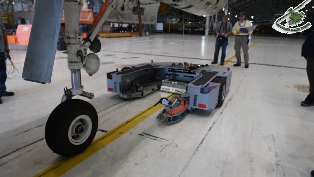 A look at Moving a Fighter Jet with a Remote Control TF-5 Tug - YouTube