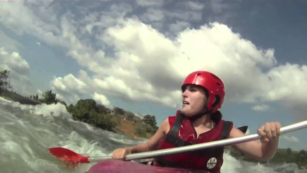 Funny scared girl running grade 5 rapid Itanda falls in a tandem kayak ...