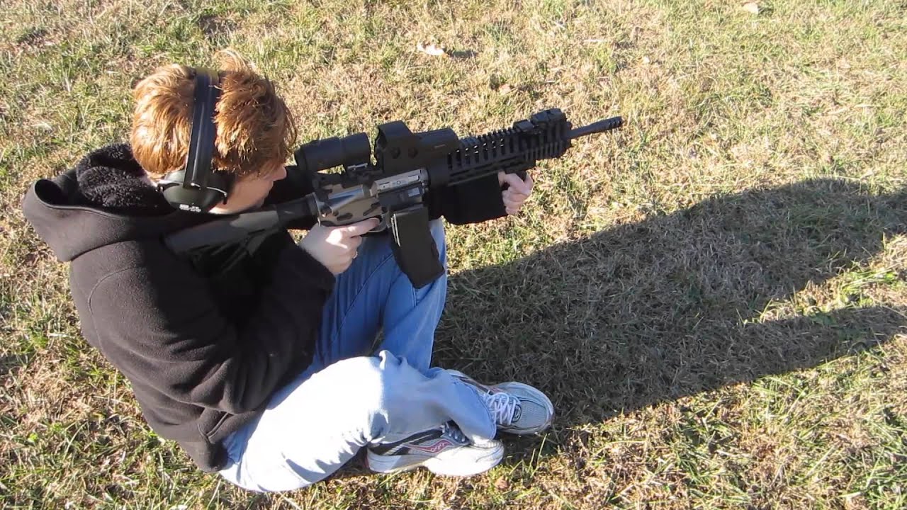 Heather Shooting her first long gun and AR - YouTube