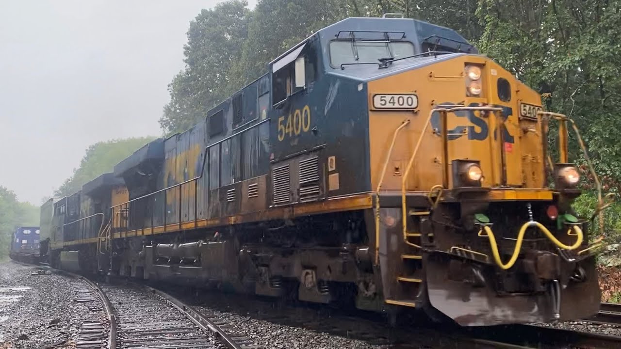 CSX 5400 and 5437 power CSX I022 through the heavy rain with unusual ...