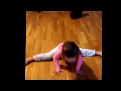 A little girl doing the splits