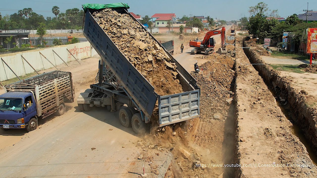 Amazing Powerful Dump Truck Dumping Rocks Fill Side Road Building ...