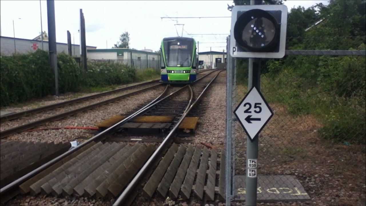 New Tramlink Tram 2558 on new Route 4 leaving depot entrance & arriving ...