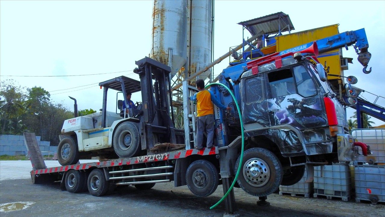 Self Loader Truck Forklift Moving An Engine Generator Set To The New ...