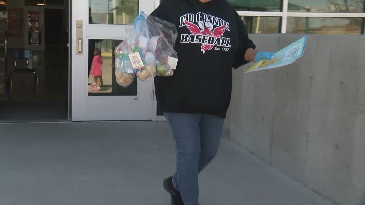 APS handing out learning packets with meals - YouTube