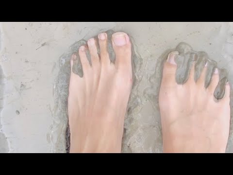 Barefoot in wet cement - YouTube
