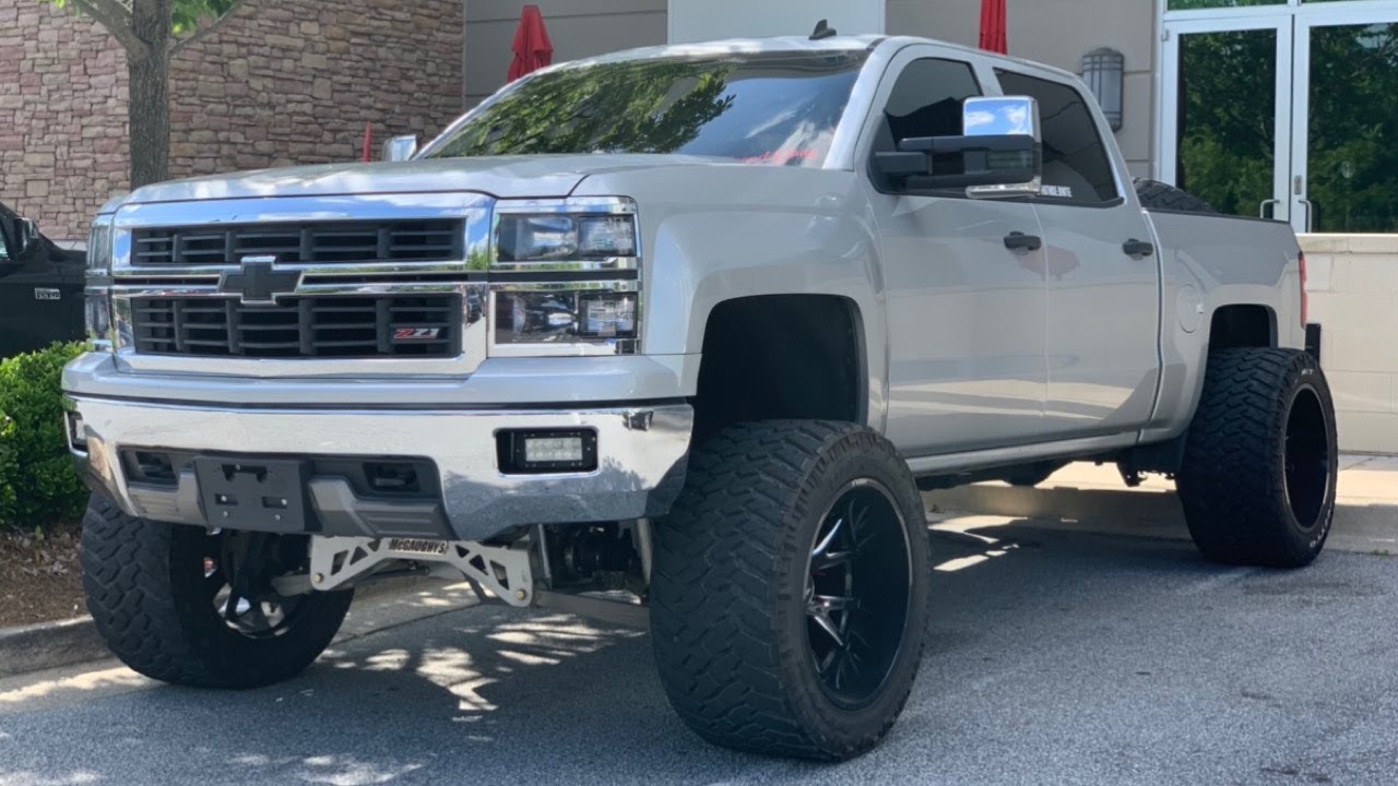 Lifted Silverado gets RIDICULOUS 4 inch spacers and CRAZY squat!! - YouTube