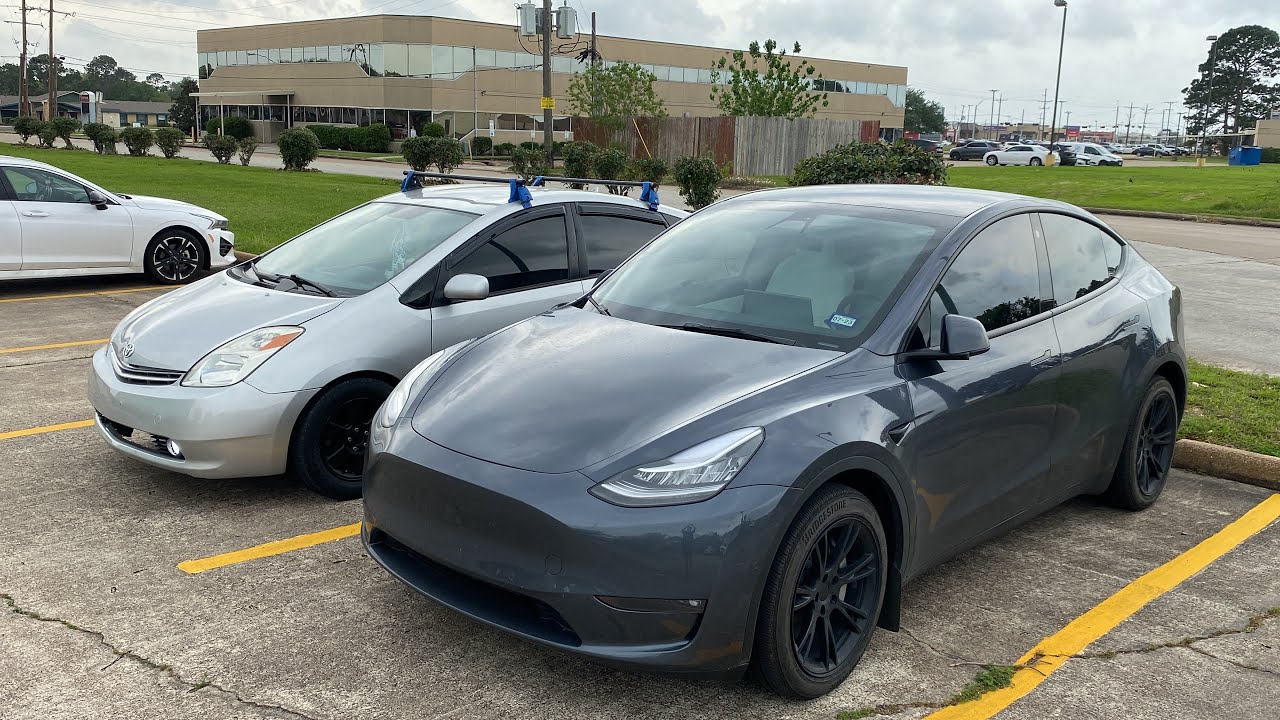 Omg a Tesla model y parked next to my gen 2 Prius this is the best day ...