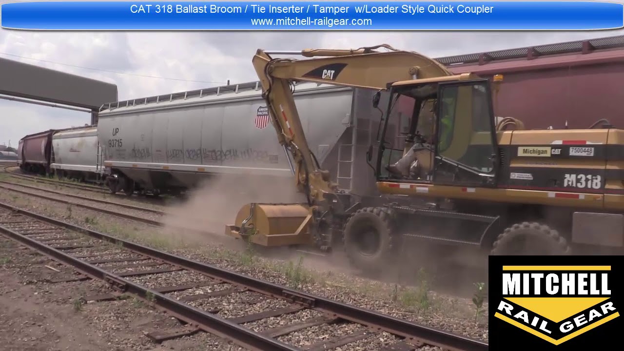 CAT M318 Ballast reg tamper loader q hitch - YouTube