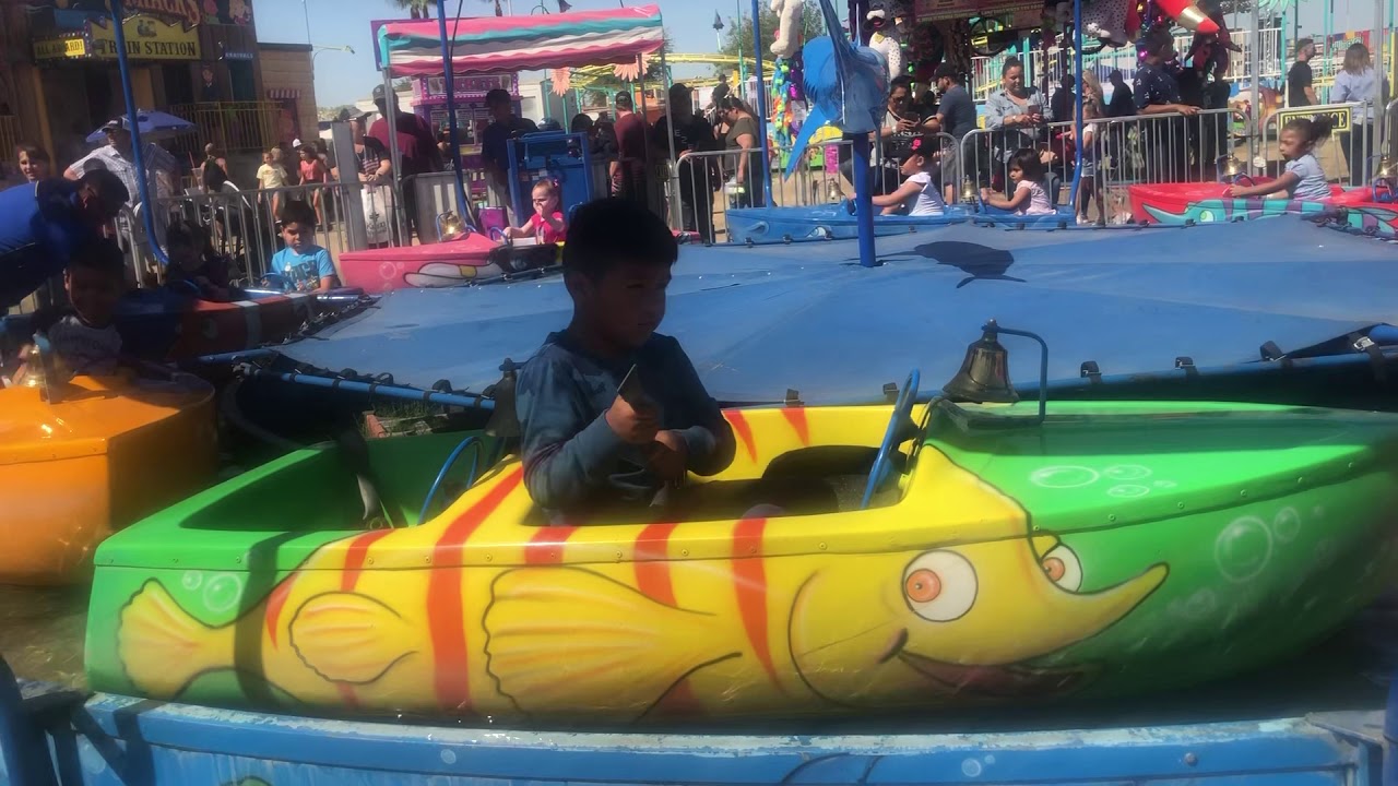 Erick in Kern County Fair riding a boat - YouTube
