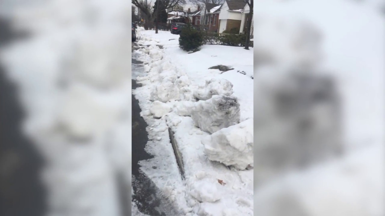 Plows dump huge chunks of ice onto the sidewalks near Jane and Lawrence ...