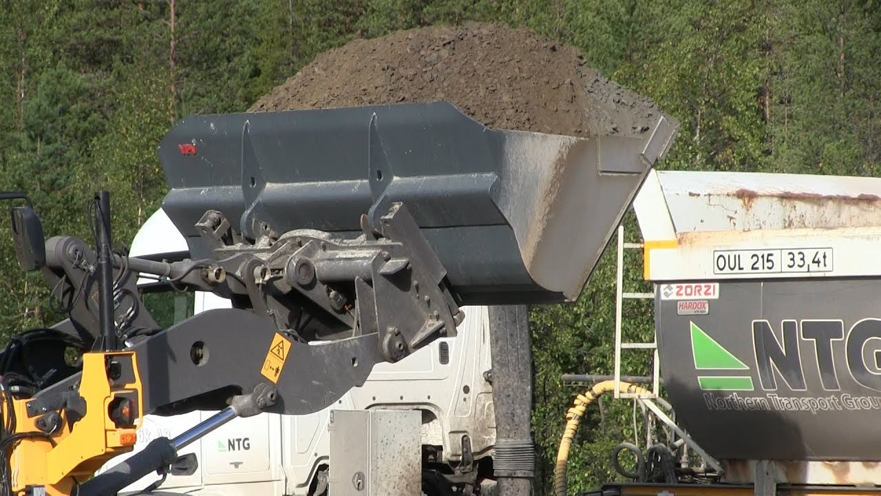 Volvo L70G loading Zorzi trailer with gravel - YouTube