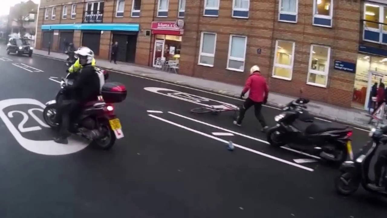 Cyclist knocked over by motorbike - YouTube