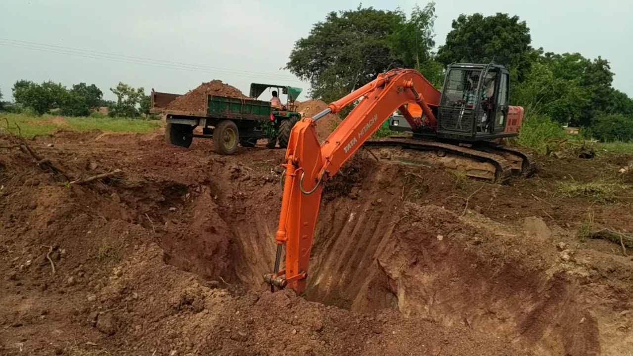 Tata Hitachi Ex 210 loading in tractors rare video - YouTube