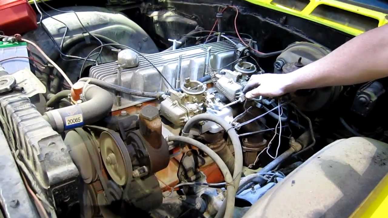 1963 Impala with Offenhauser Head and dual carbs running - YouTube