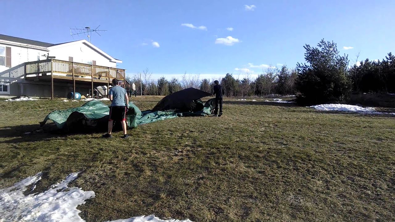 Folding a tarp on a windy day! - YouTube