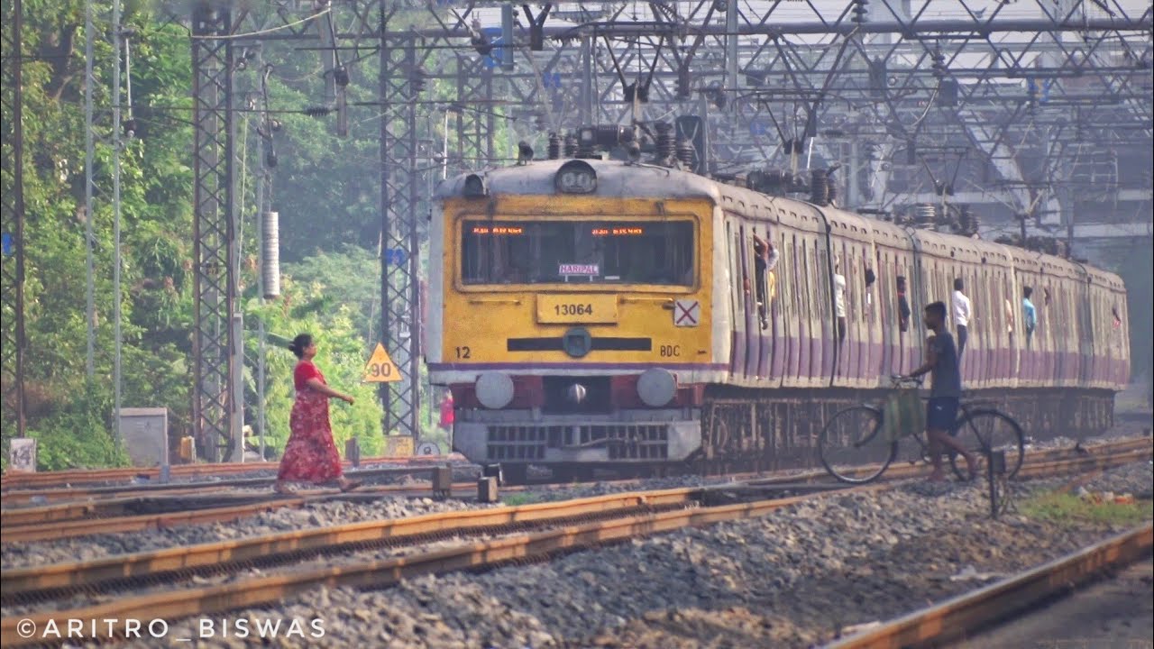 Single wind shield EMU local trains crossing rail gate | Indian ...