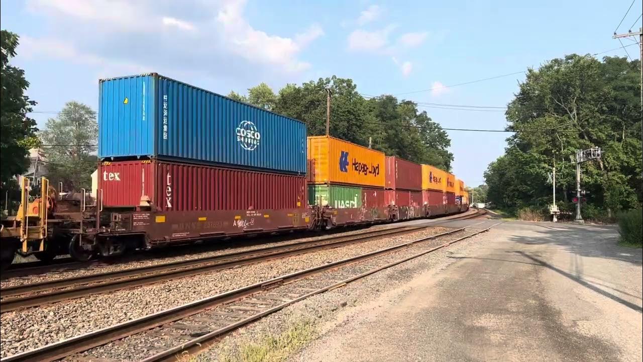 NS 8053 ES44AC leads NS 269 with a friendly crew at Piscataway - YouTube