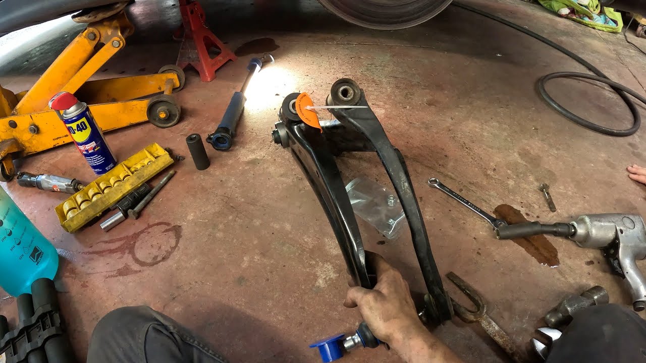 Repairing a very bent control arm after hitting a curb - YouTube