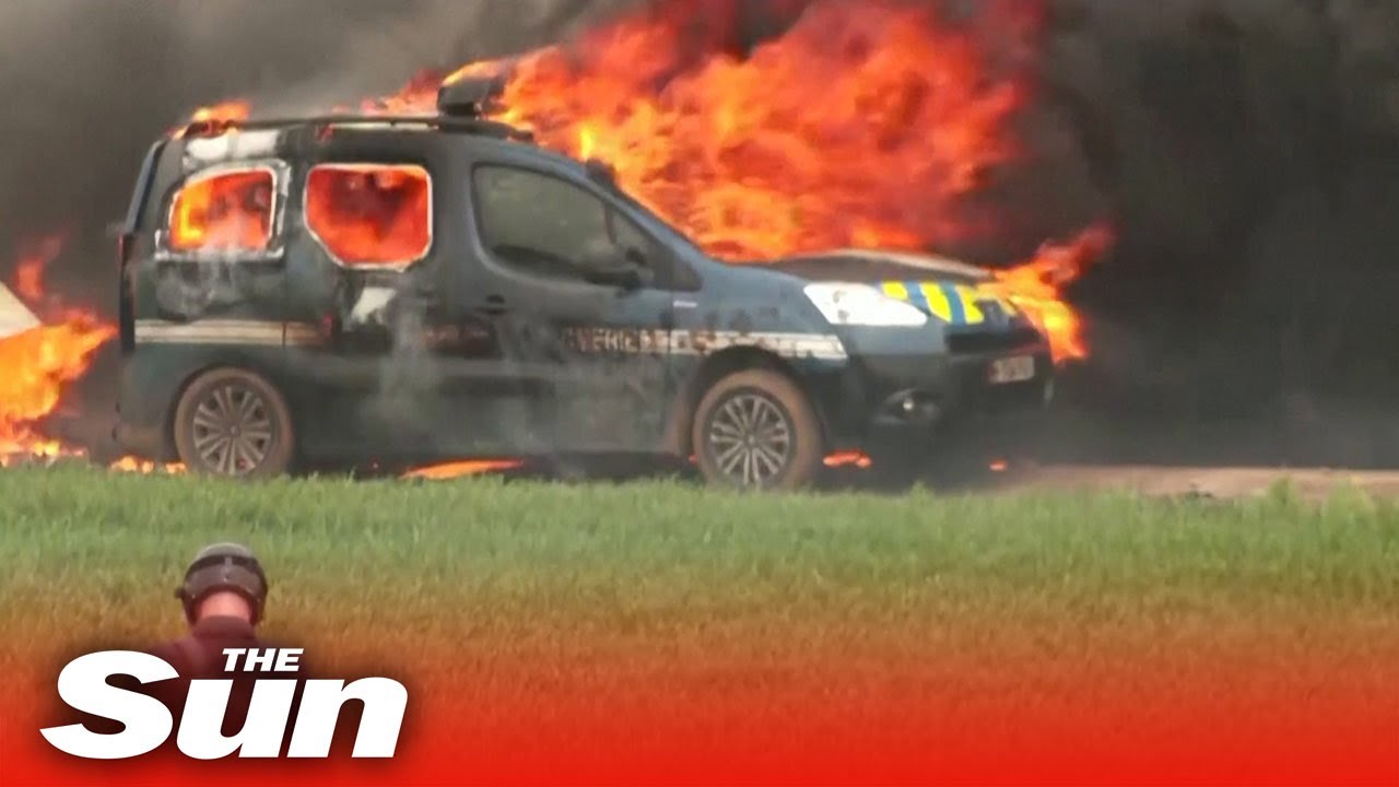 Police car on fire during protest against farm reservoir in France ...