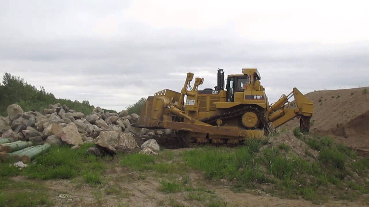 CAT D10T Dozer Pushing Boulders at Pilger, SK - YouTube