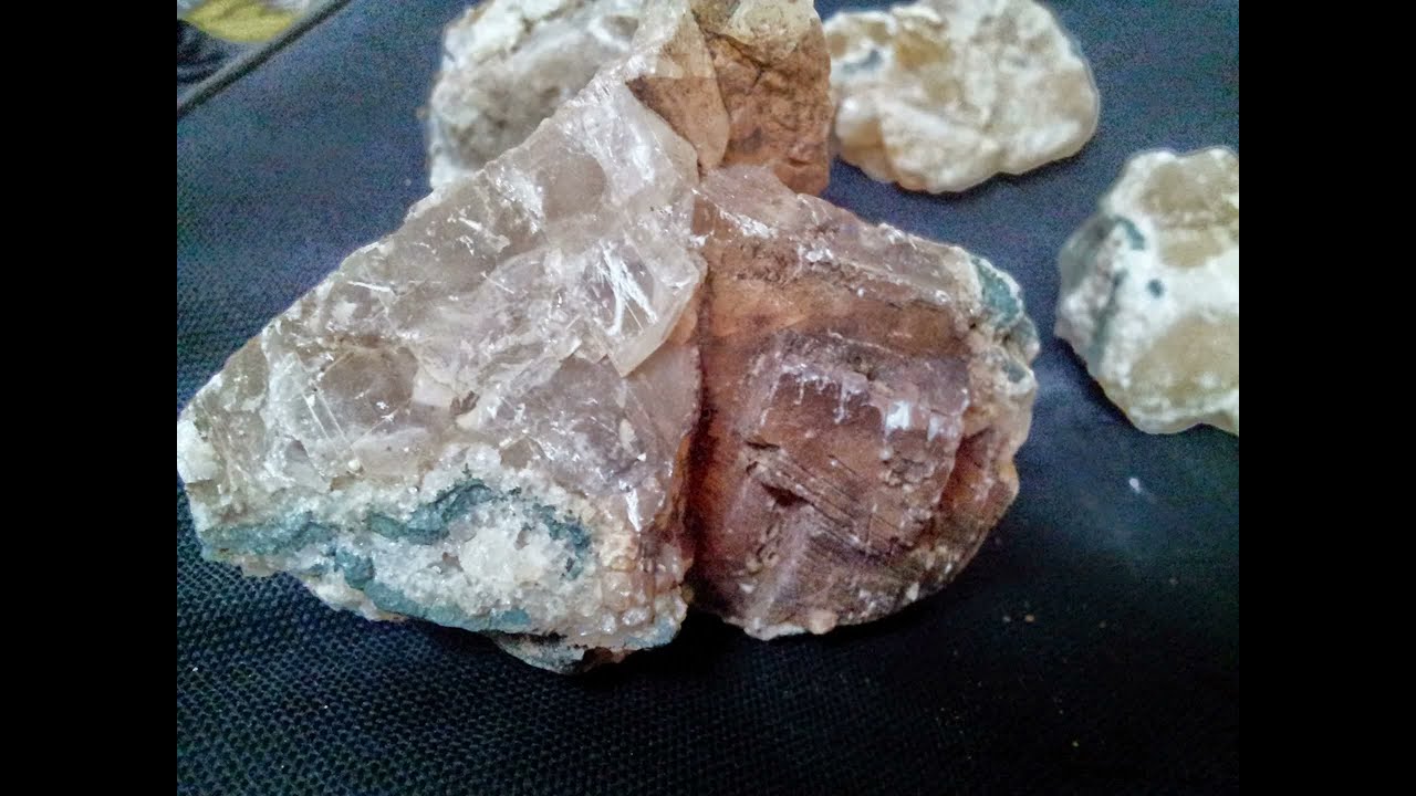 Kimberlite with rough diamonds and a range of gem stones - YouTube