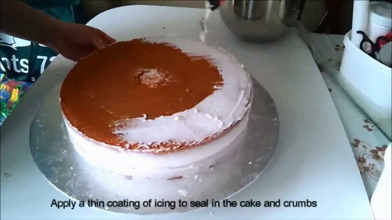 Quick tutorial on how to crumb coat or dirty ice a cake - YouTube