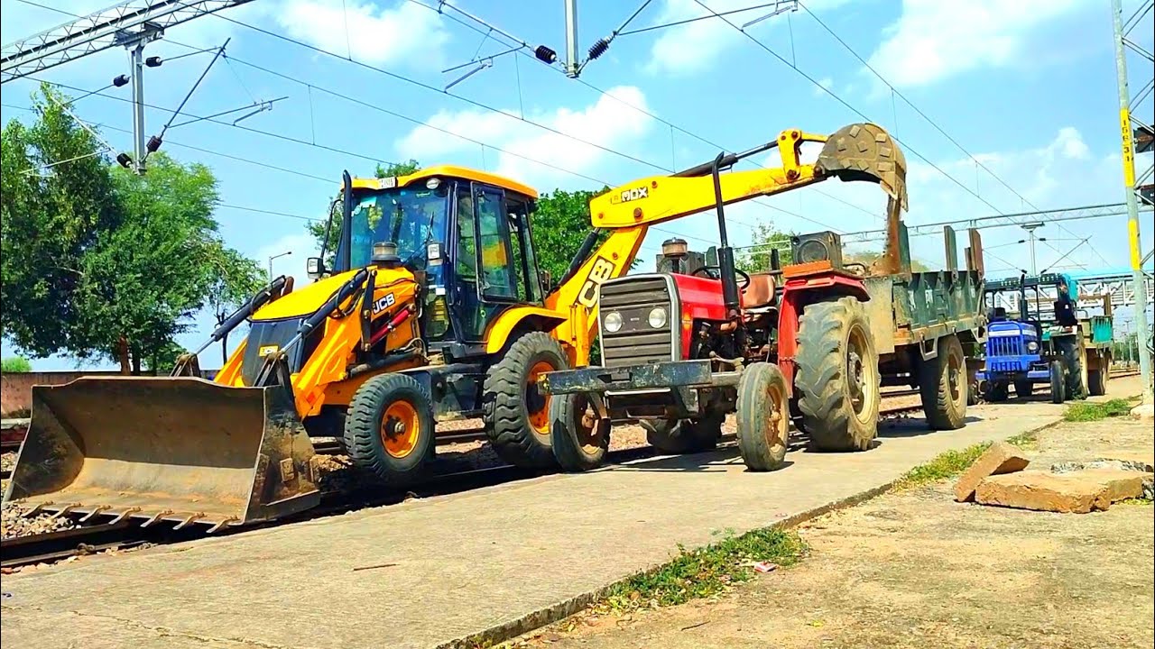 jcb backhoe loader machine and 3 tractors working railway contraction ...