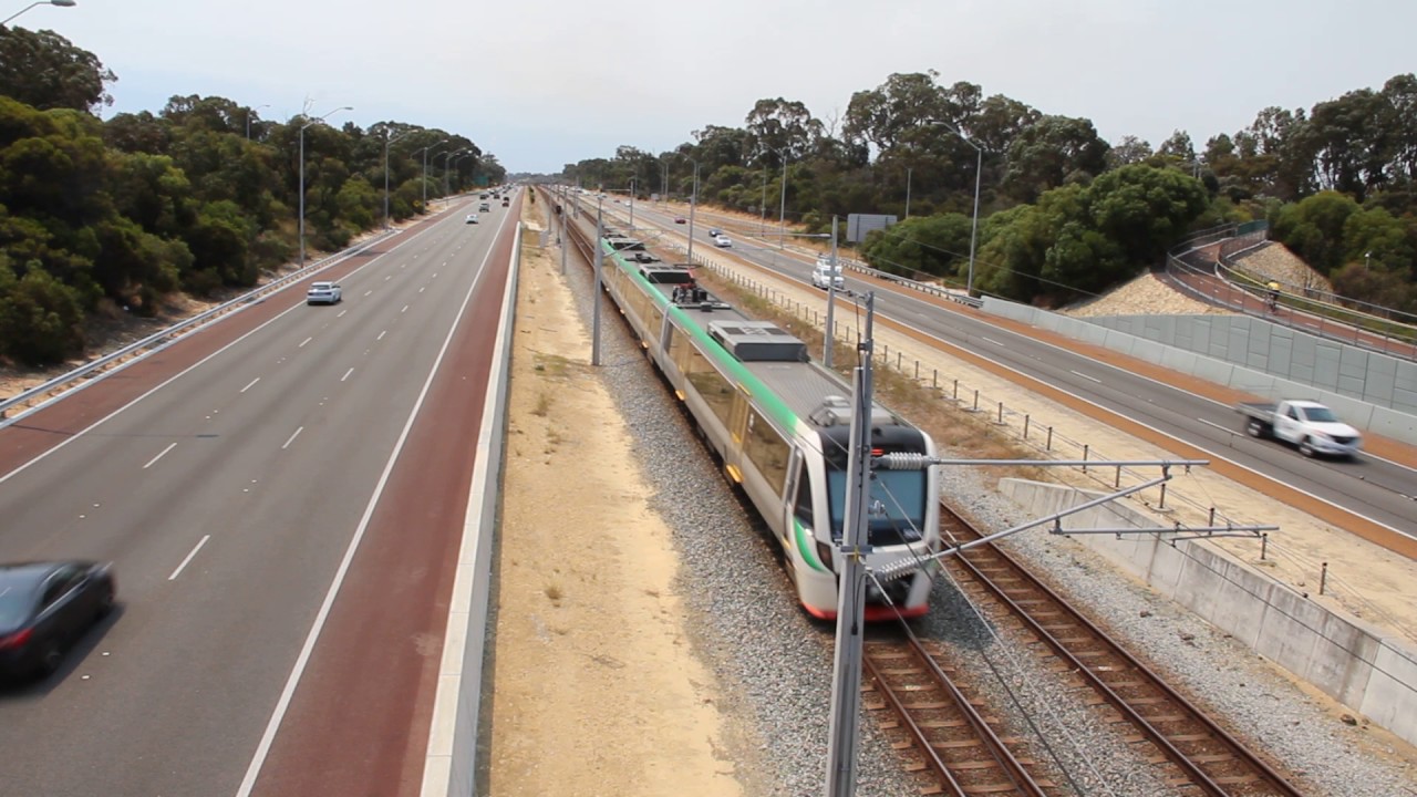 Trains run down freeways in Perth 2016 - YouTube