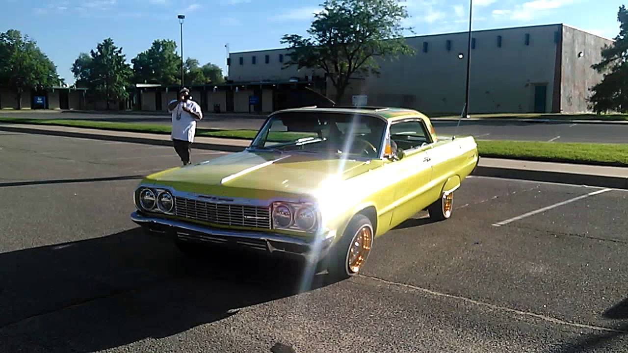 64 Chevy Impala On Gold Daytons - YouTube