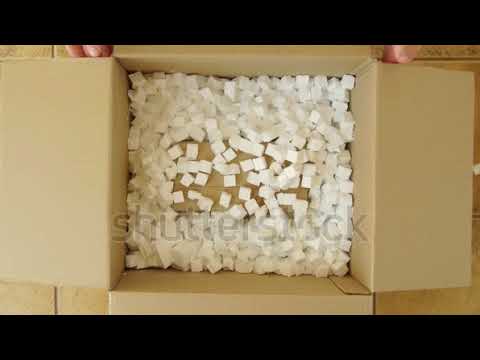 A young man hands close a parcel contains a gift....