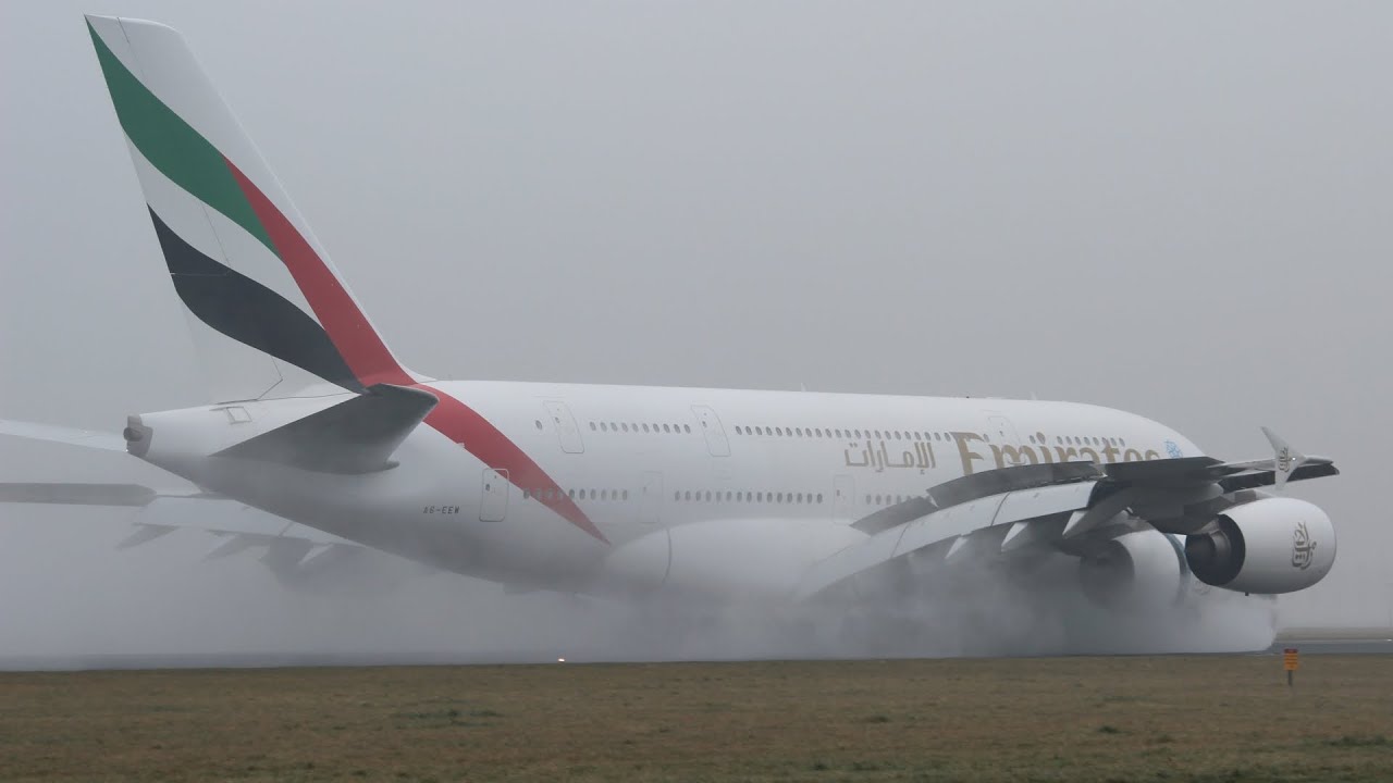 Emirates Airbus A380 Landing at Foggy Amsterdam! Amazing Water Spray ...