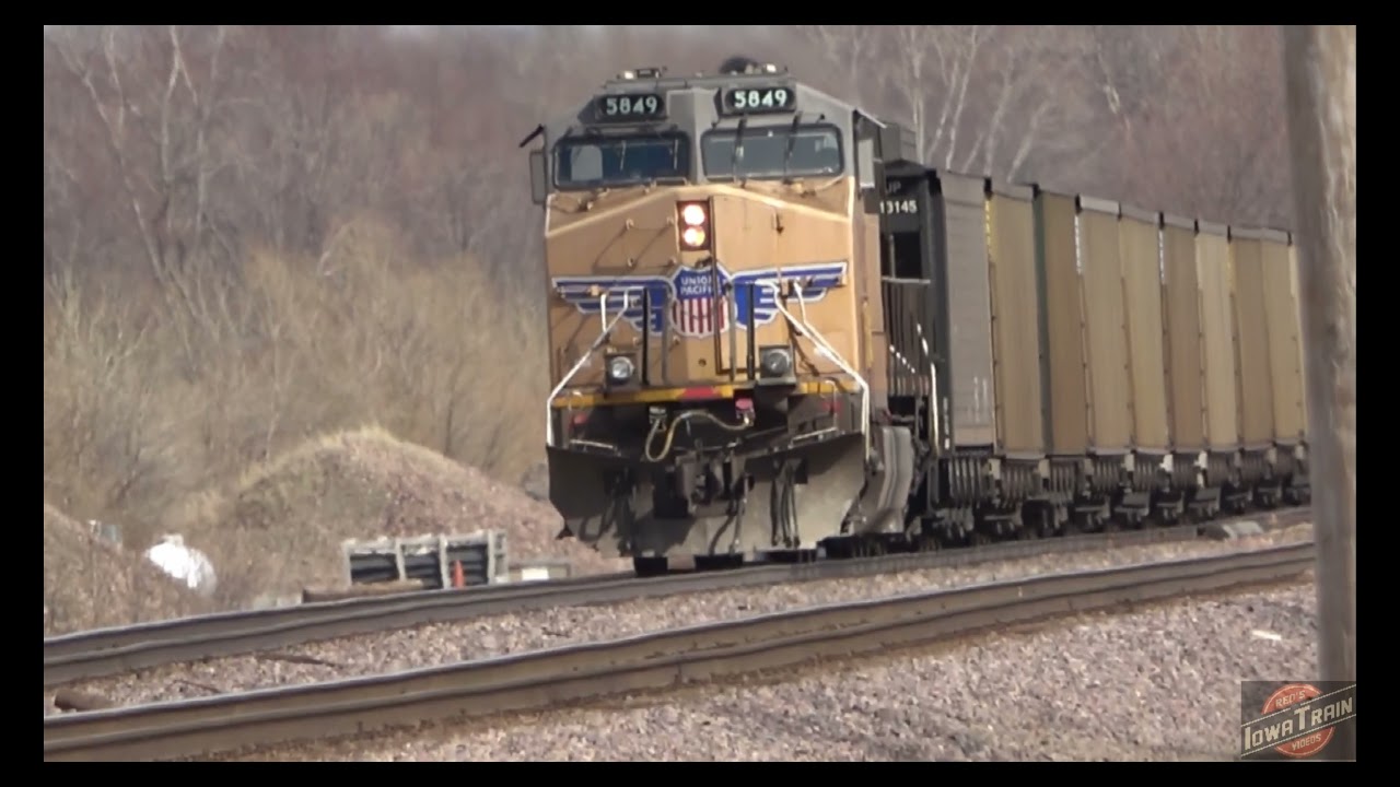 Lots of CNW coal cars. UP autorack train at the old HWY 30 overpass in ...