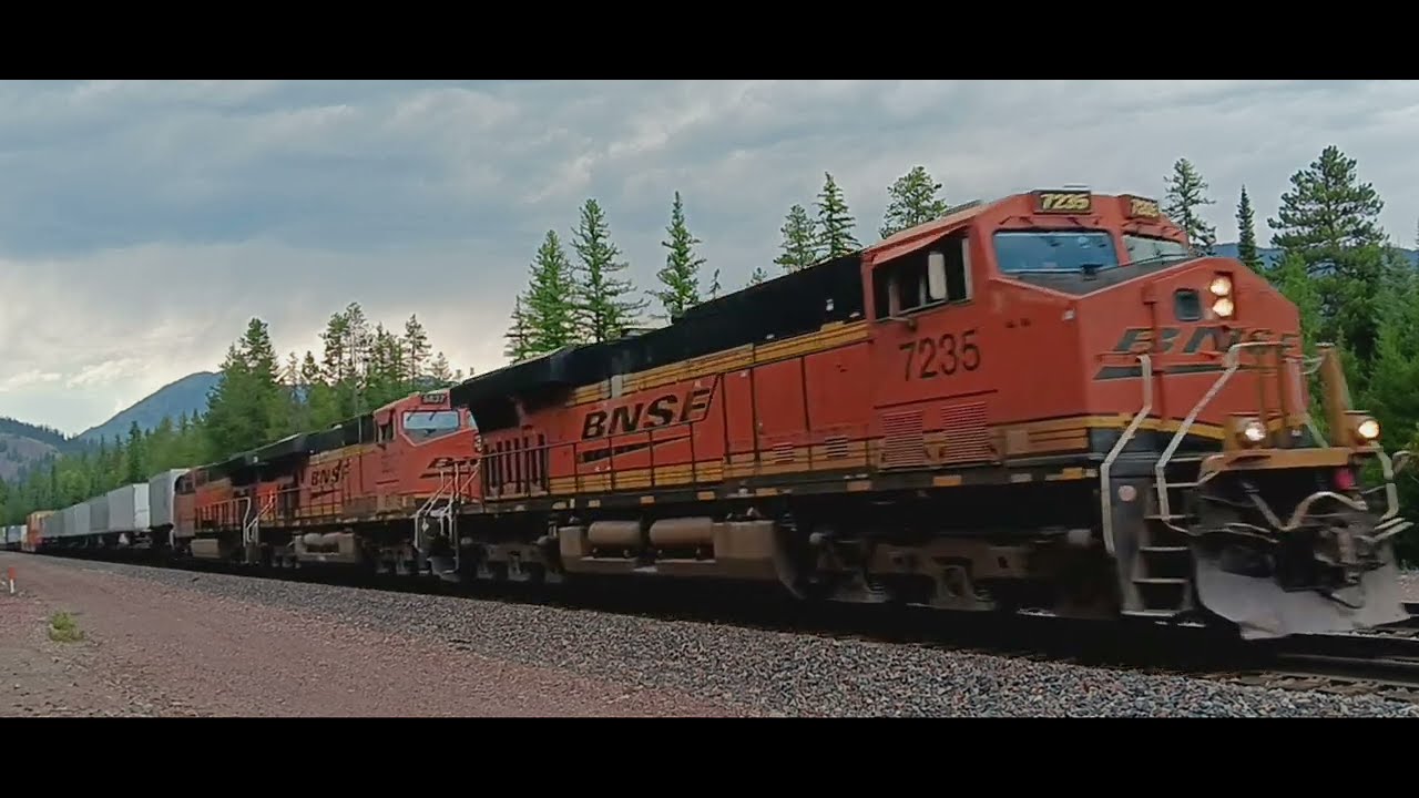 BNSF Eastbound Stack Train pulling up Stanton Creek on the Highline in the Rockey Mountains ...